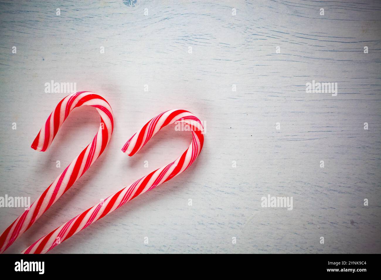 red candy canes on white - Christmas sweets Stock Photo - Alamy