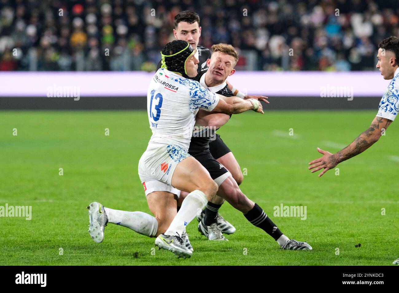 Damian McKenzie of New Zealand (R) and Juan Ignacio Brex of Italy (L ...