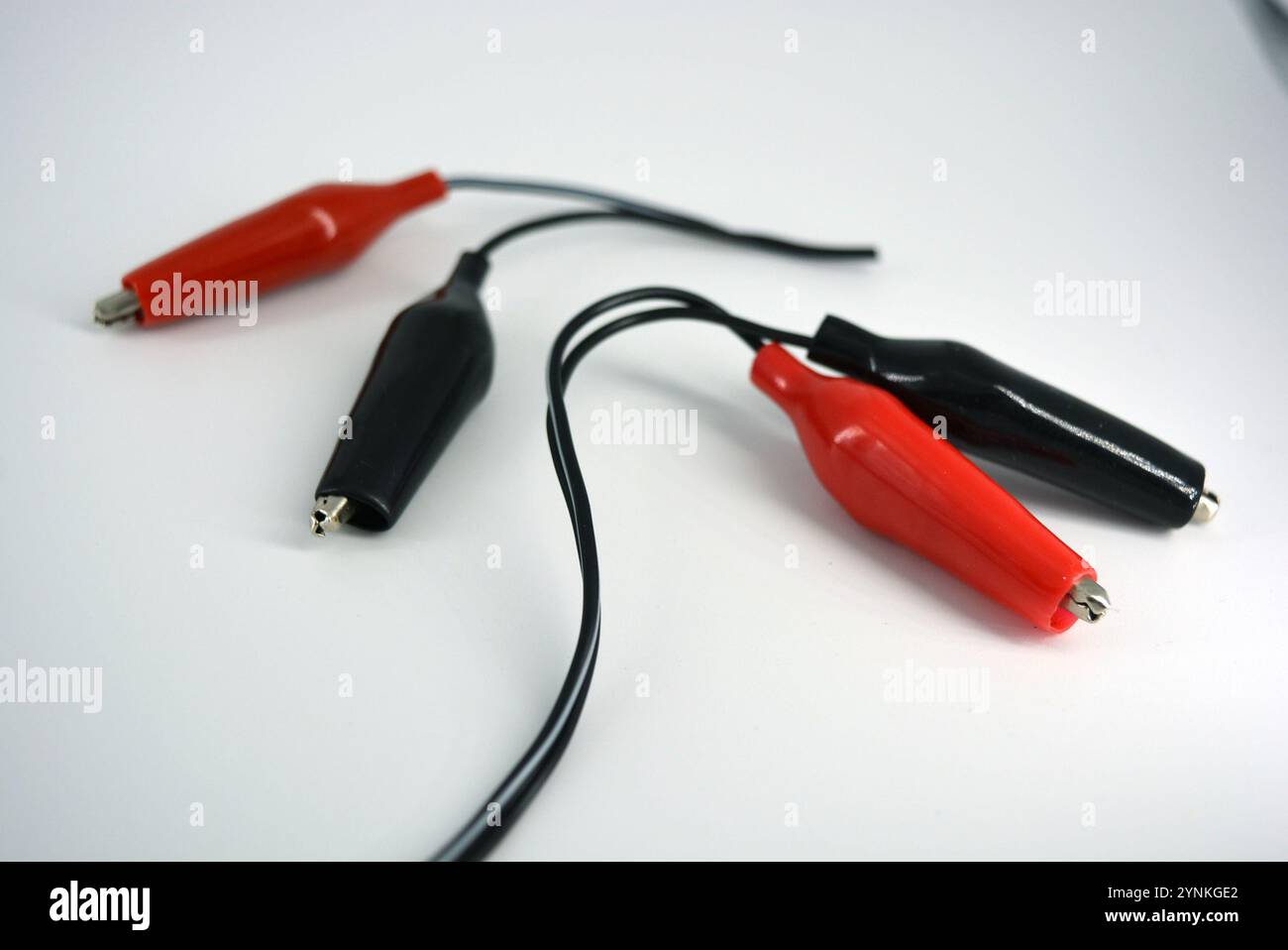 Black wire with red and black insulation, rubber and metal crocodiles ...