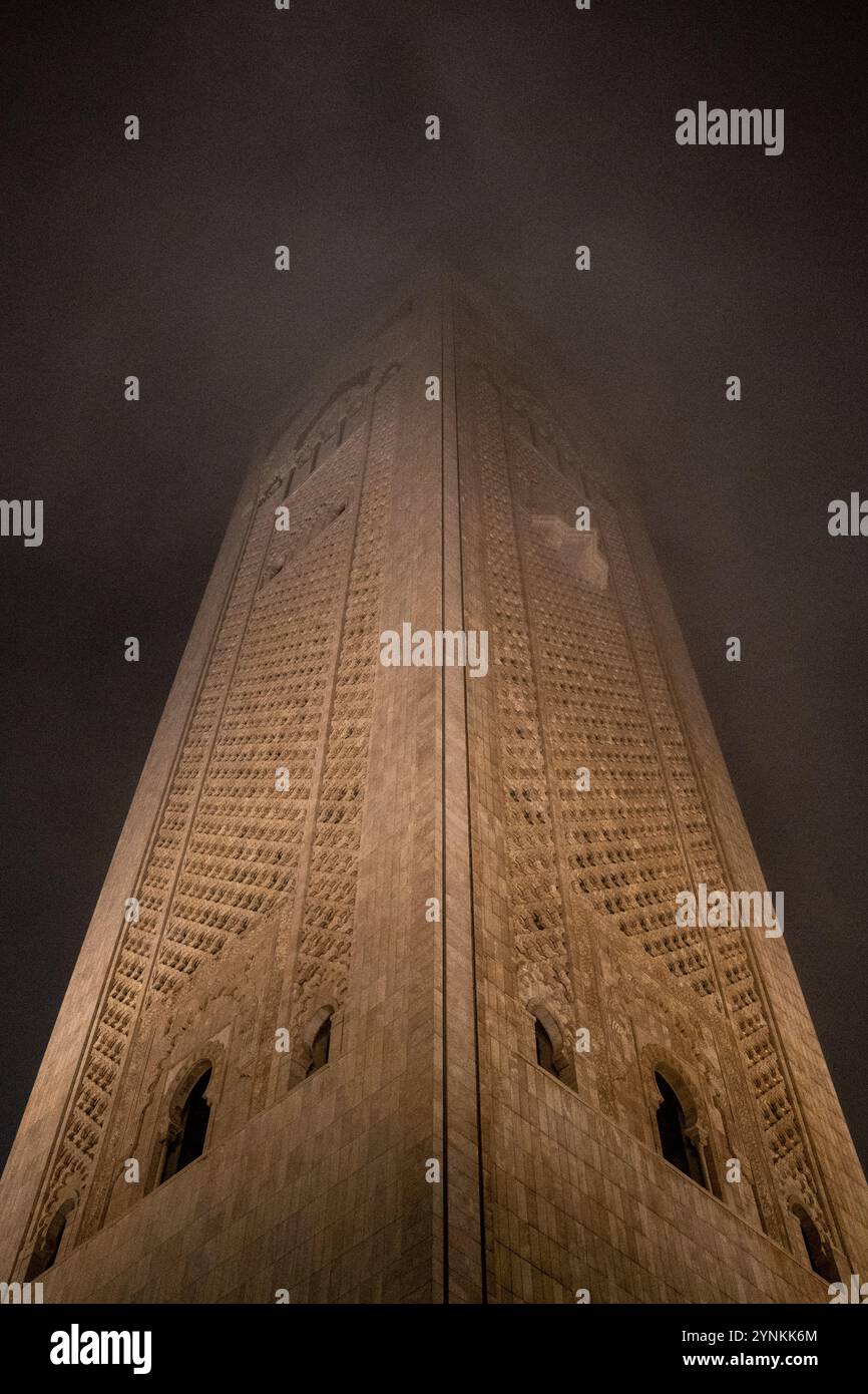 The minaret in the mist on evening prayer time at the Hassan II Mosque ...