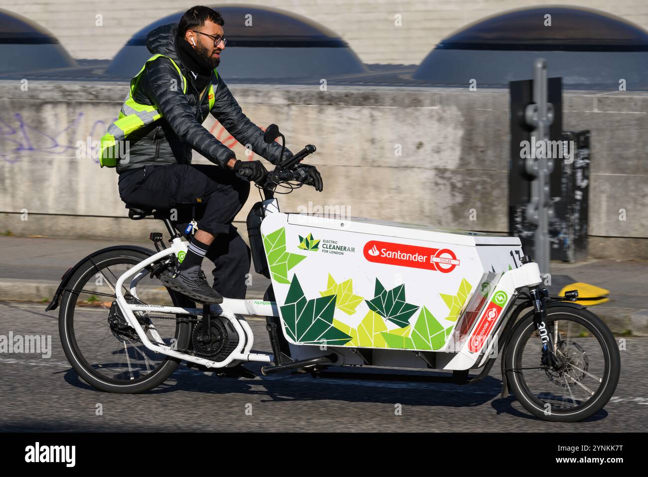 Man riding on an e cargo bike hi-res stock photography and images - Alamy