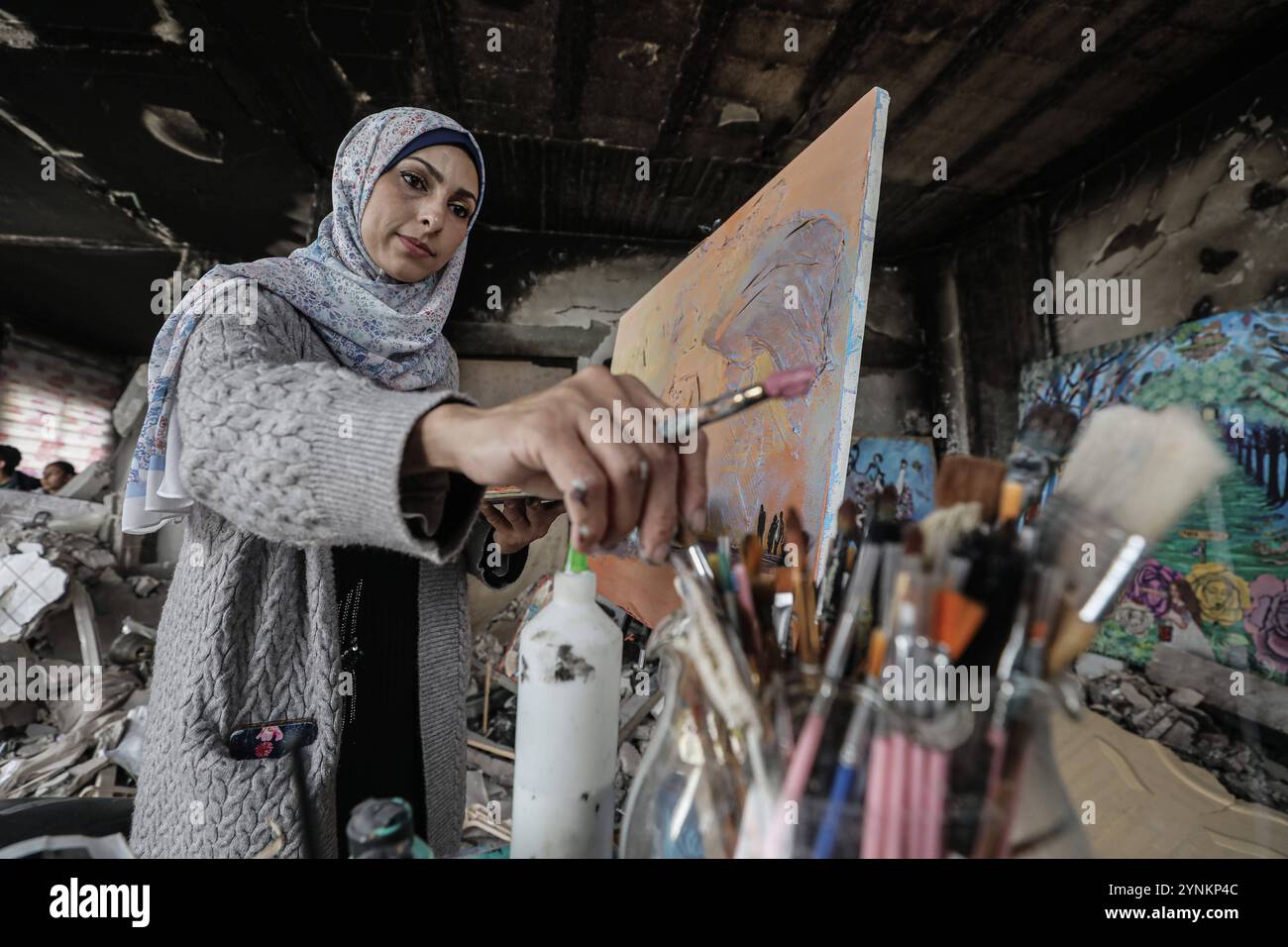 Meysa Youssef, a 40-year-old Palestinian collage artist who lost both ...