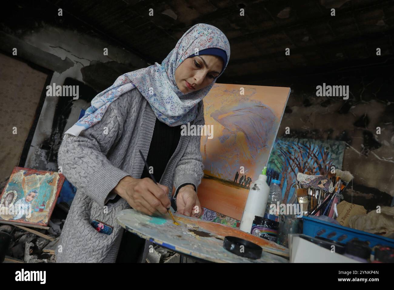 Meysa Youssef, a 40-year-old Palestinian collage artist who lost both ...