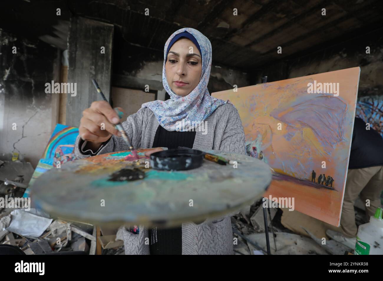 Meysa Youssef, a 40-year-old Palestinian collage artist who lost both ...