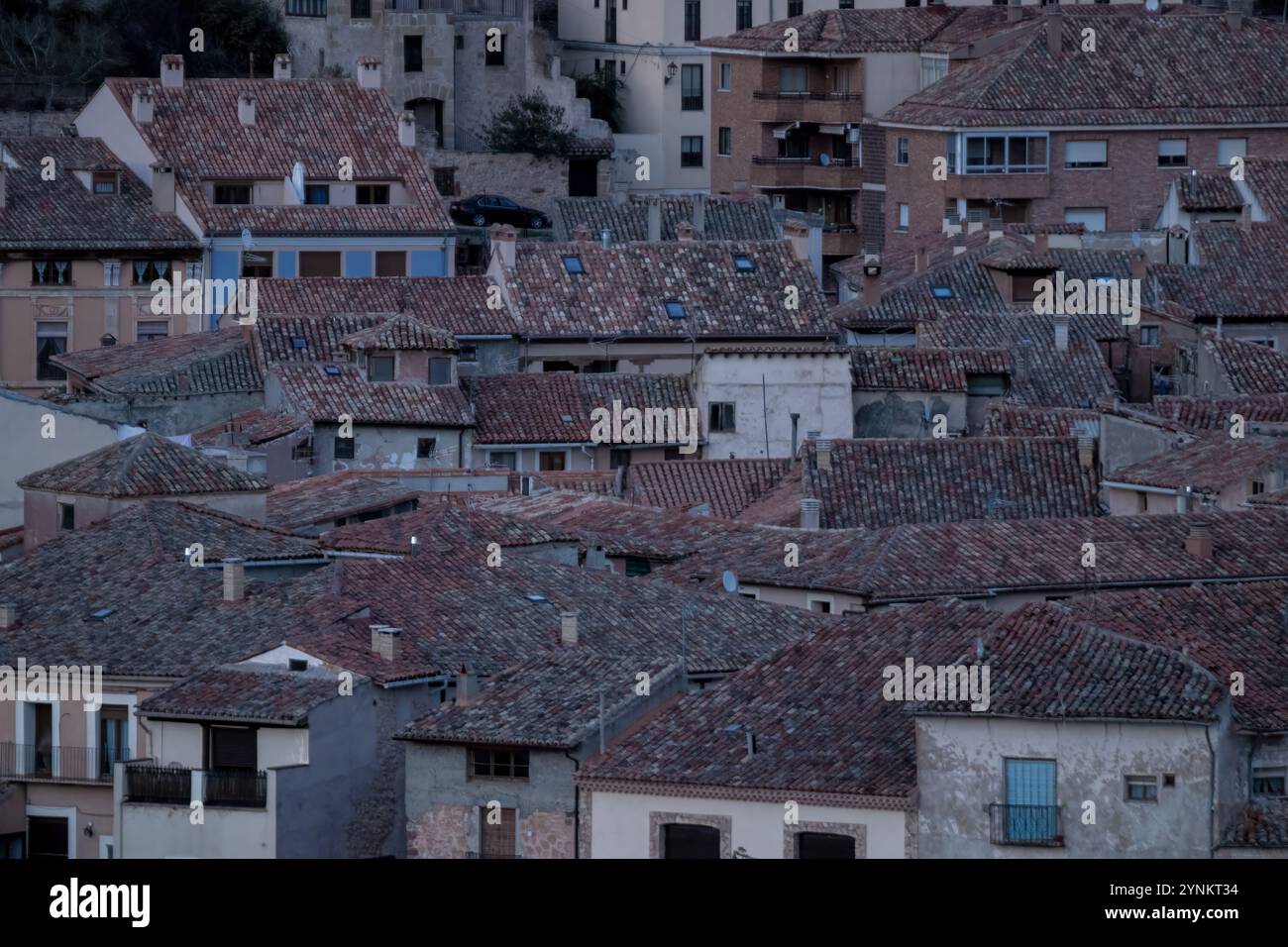 Cluster of traditional tiled rooftops in a quiet medieval village at ...