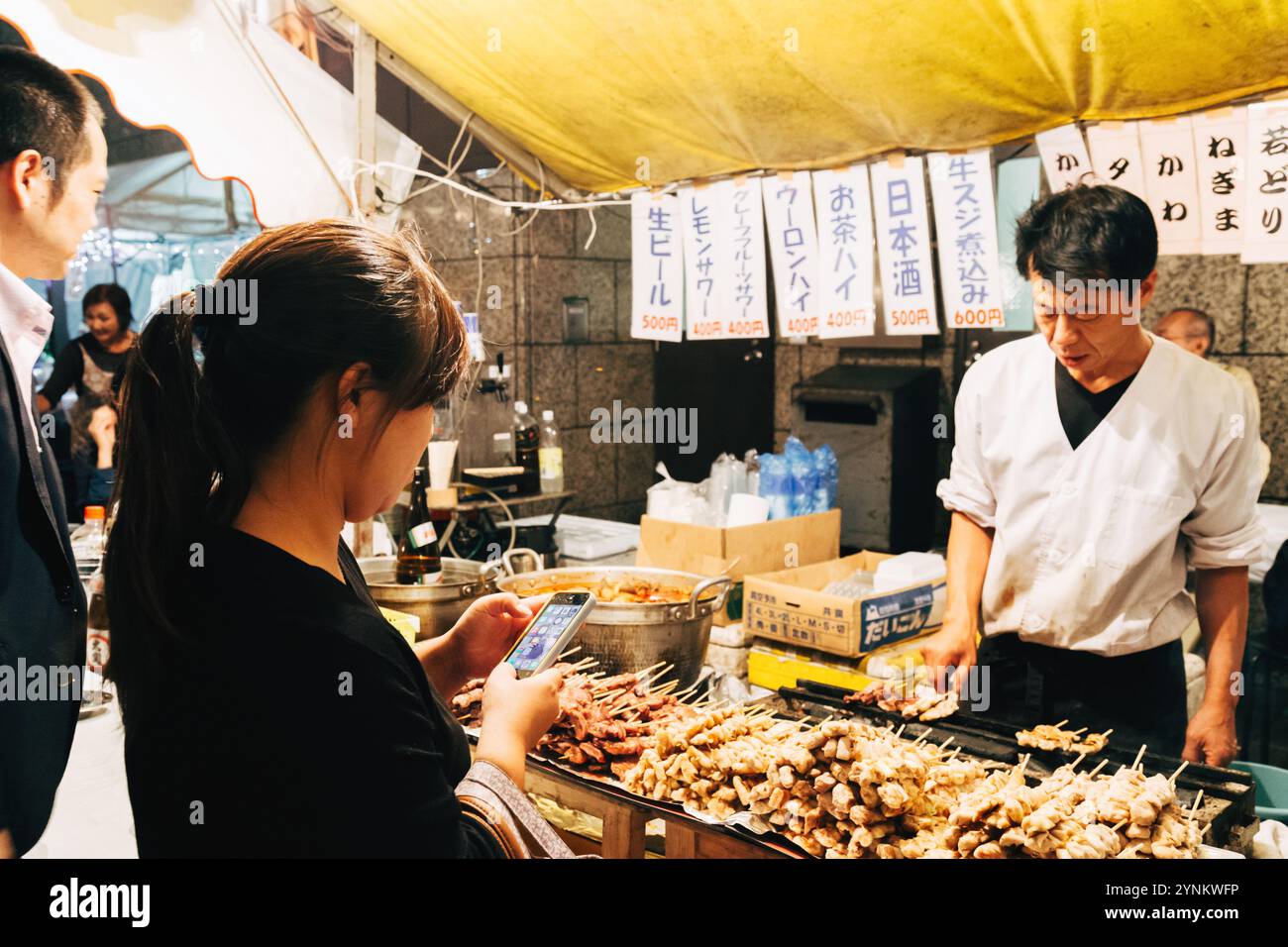 Tokyo, Japan - November 26, 2024 : Local Japanese street food at night ...