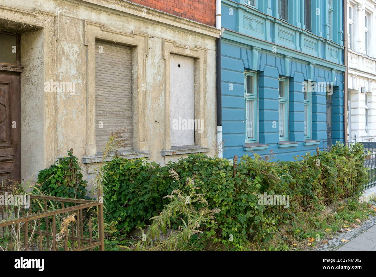 Detailed view of an old and a renovated house facade Stock Photo - Alamy
