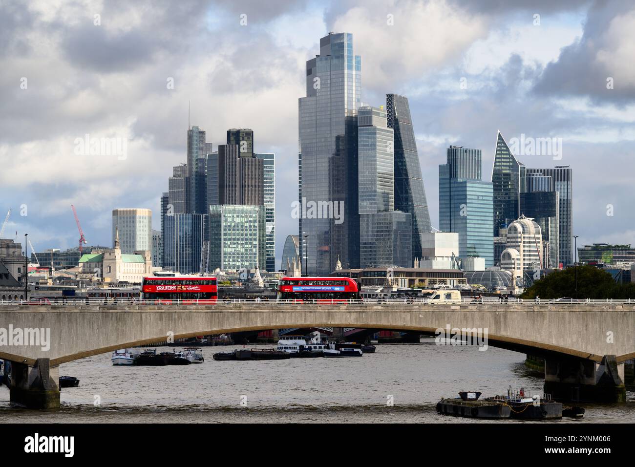 Double-decker buses crossing Waterloo Bridge over the River Thames ...