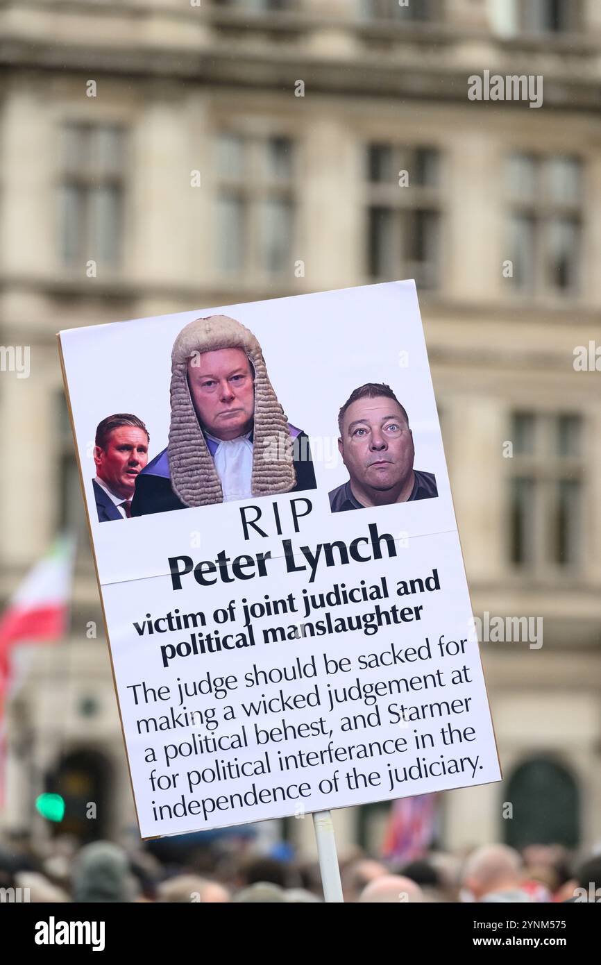 A placard at the "Uniting the Kingdom" rally in memory of Peter Lynch ...
