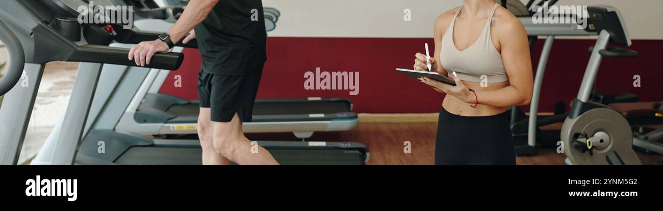 Monitoring Fitness Progress at Gym on Treadmill Stock Photo - Alamy