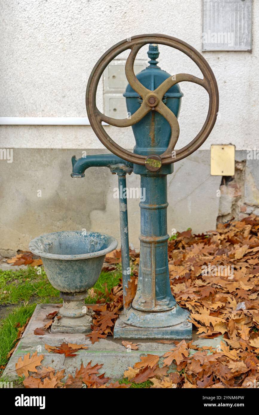 Old Hand Pump Drinking Water Well in Town at Autumn Day Stock Photo - Alamy