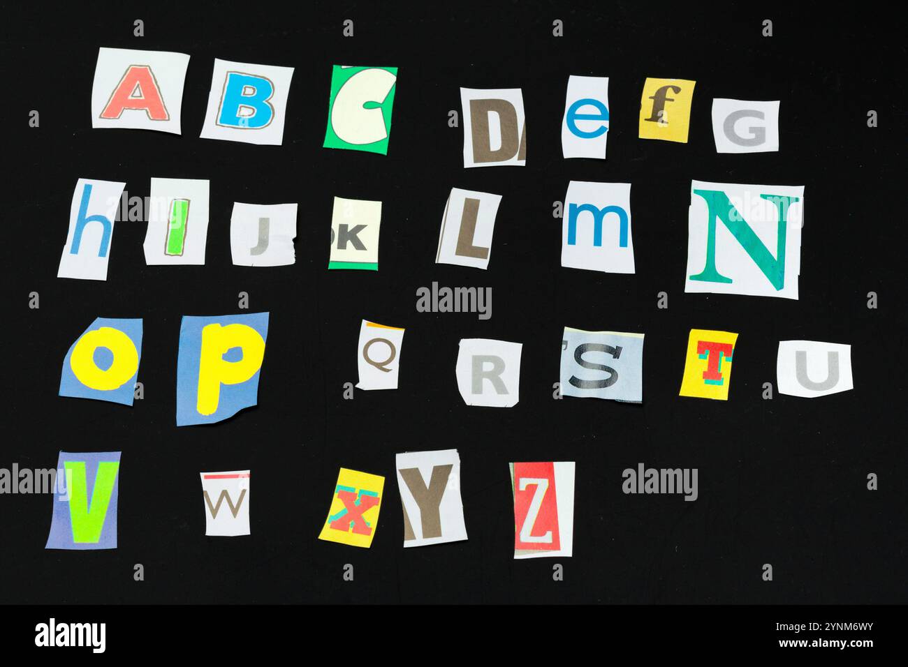 Colorful newspaper alphabet isolated on black Stock Photo - Alamy