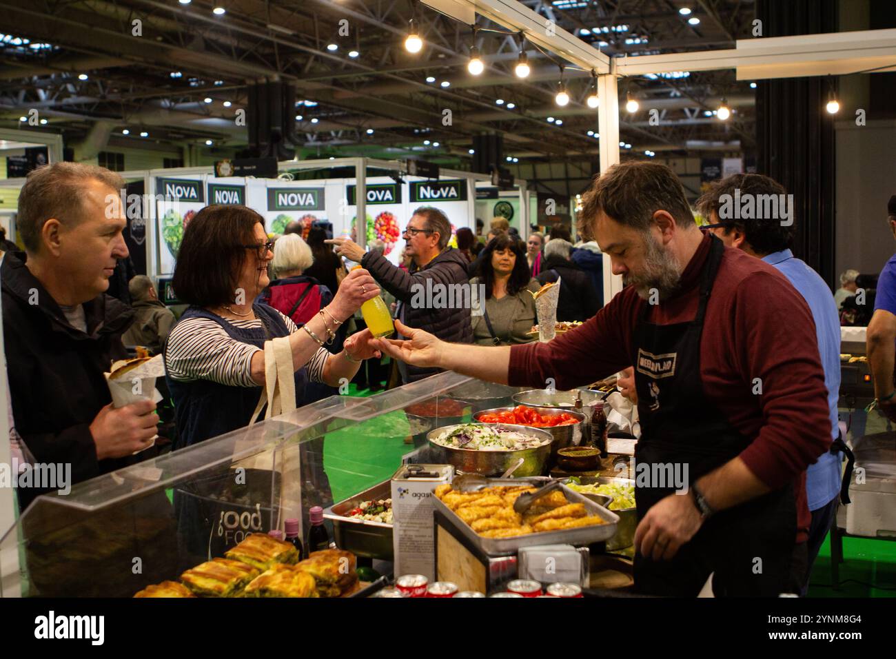 a phot of the Greek Soulvaki Stall serving people at the Winter Goodfood Show at the NEC in ...