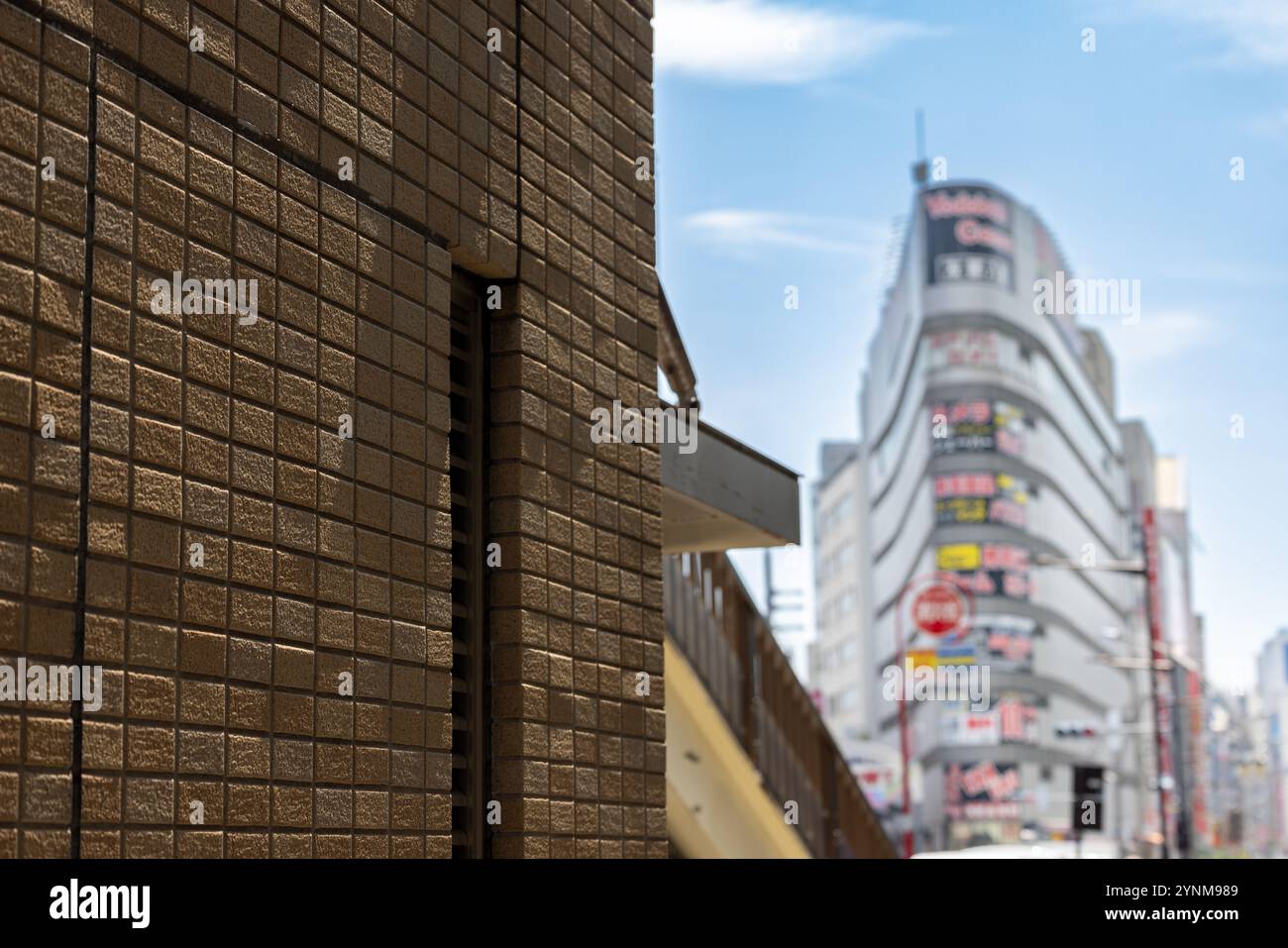 Urban contrast of brick facade and modern architecture in Tokyo Stock ...