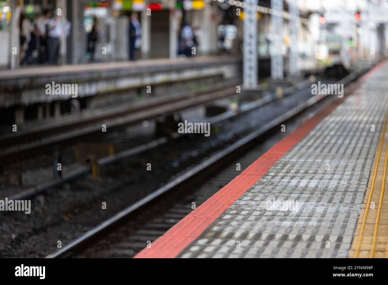 Empty train platform with railway tracks Stock Photo - Alamy