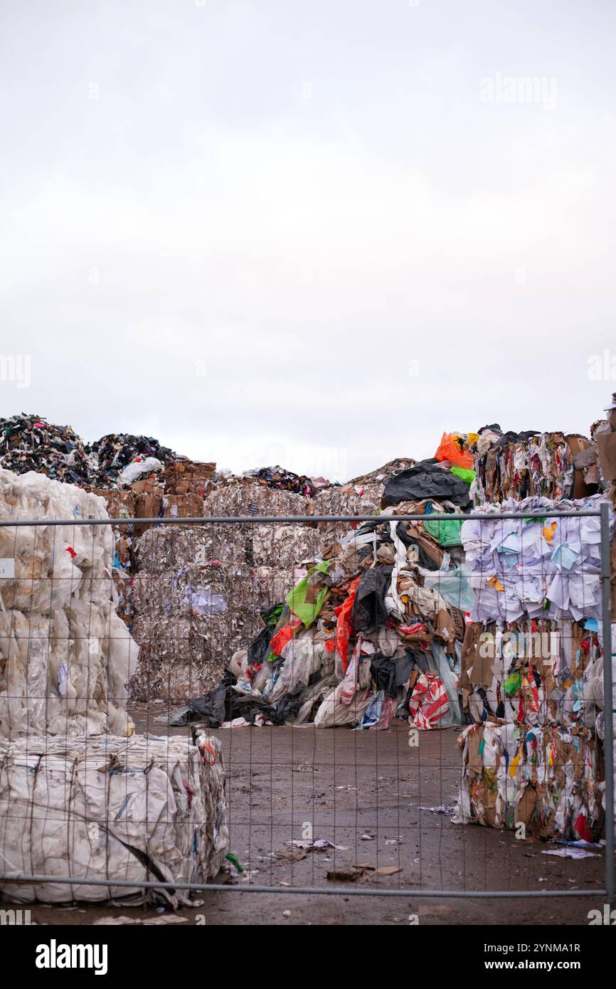 Sorted garbage at the dump behind the fence Stock Photo - Alamy