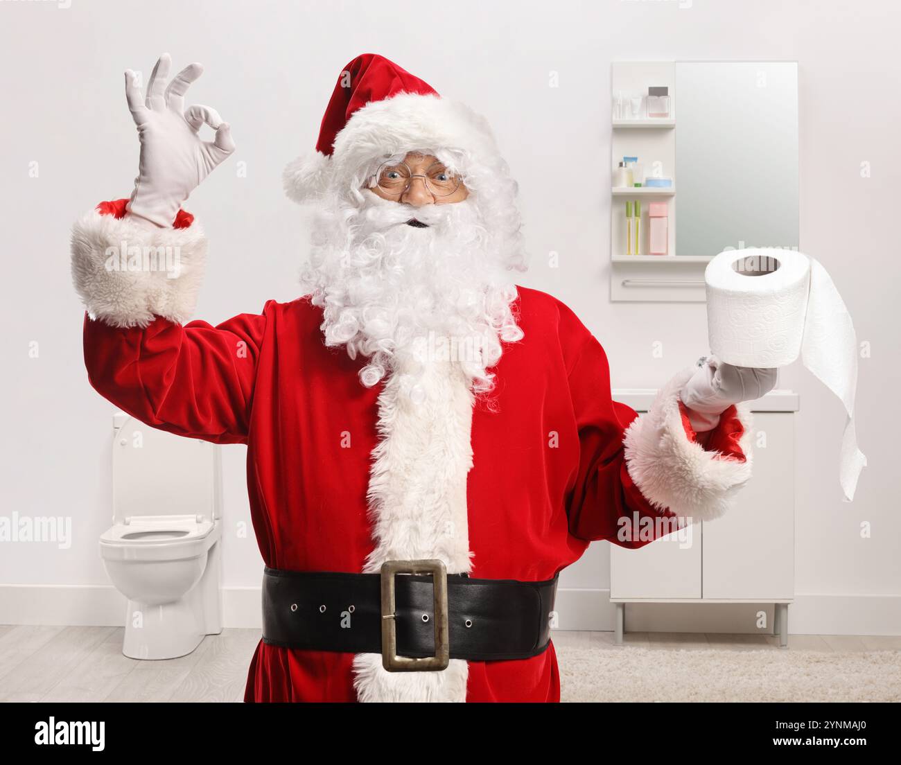 Santa claus holding a toilet paper roll and gesturing good sign inside ...