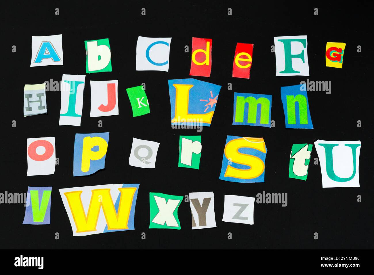 Colorful newspaper alphabet isolated on black Stock Photo - Alamy