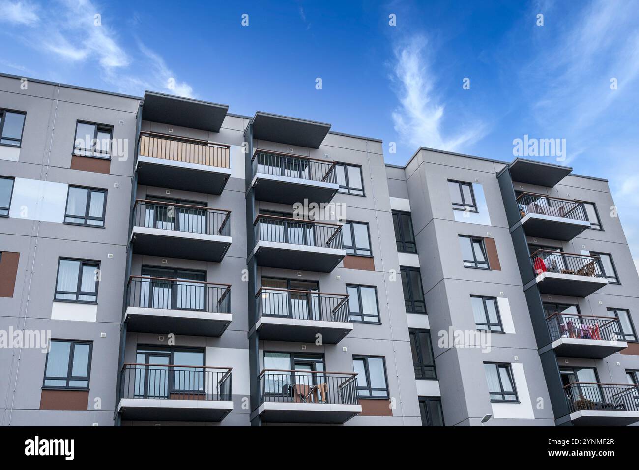 A modern and stylish apartment complex that showcases spacious ...