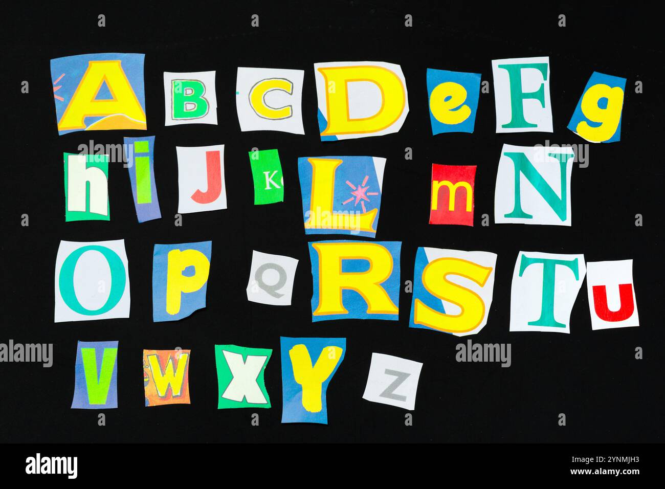 Colorful newspaper alphabet isolated on black Stock Photo - Alamy