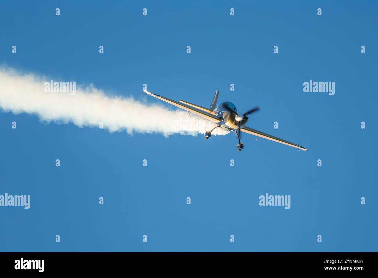 Stunt aerobatic plane performing stunts in air Stock Photo - Alamy