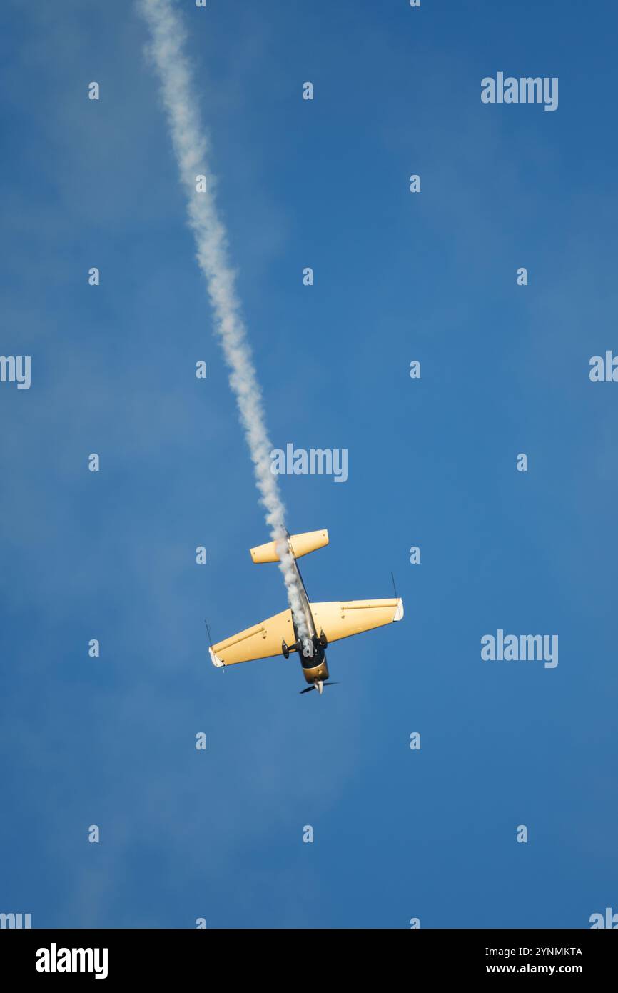 Stunt aerobatic plane performing stunts in air Stock Photo - Alamy