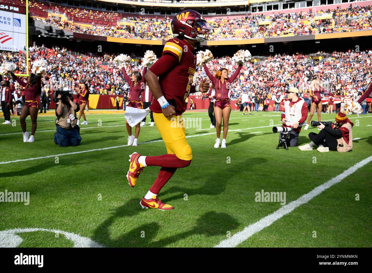 Washington Commanders quarterback Jayden Daniels (5) takes to the field ...