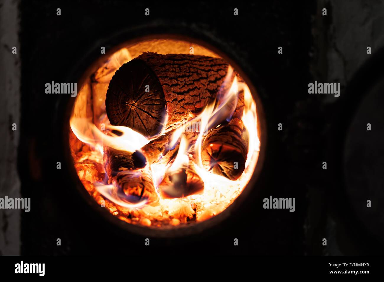 Flames firewood burning inside stove hi-res stock photography and ...