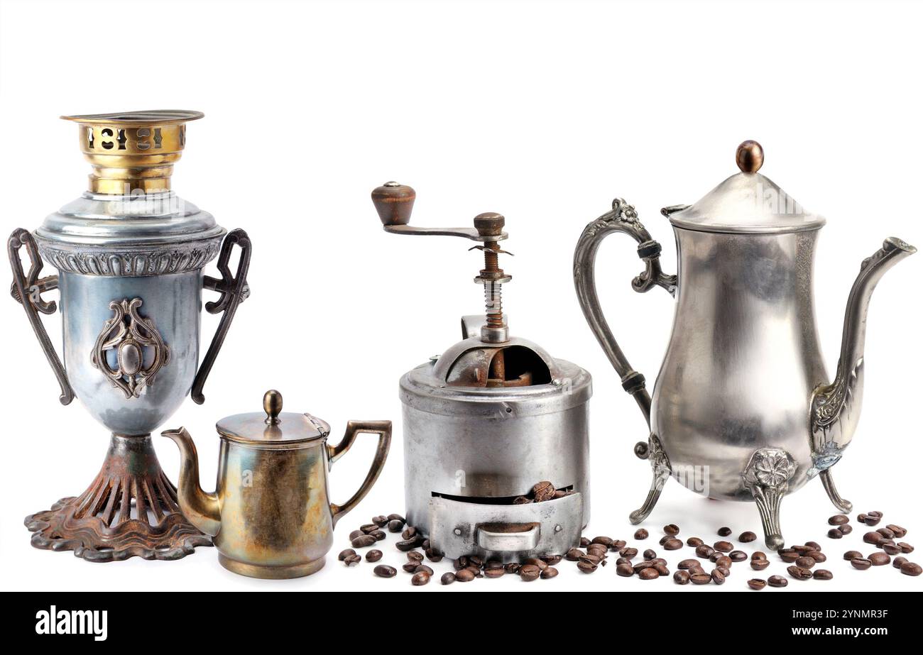 Old coffee pot, samovar, grinder coffee and beans isolated on white ...