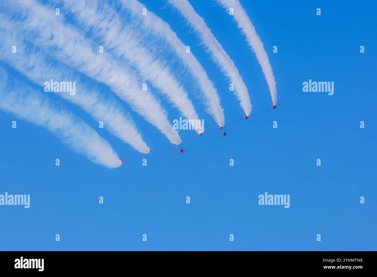 The iconic Red Arrows perform an awe-inspiring formation flight, showcasing exceptional ...