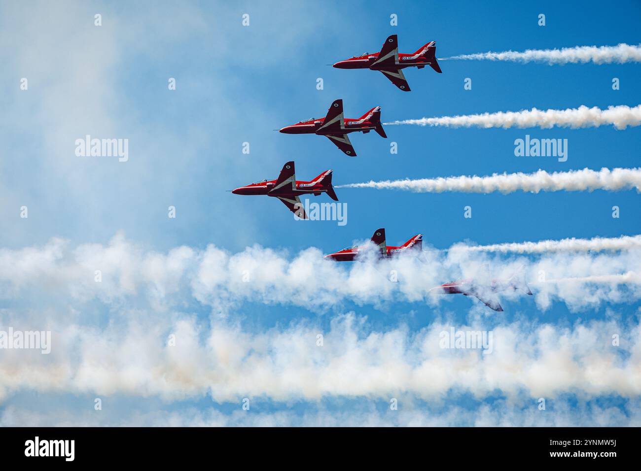The Red Arrows perform a dramatic split formation, leaving intricate ...