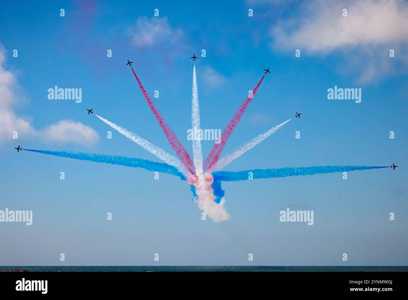 The Red Arrows perform their iconic fan formation, painting the sky ...