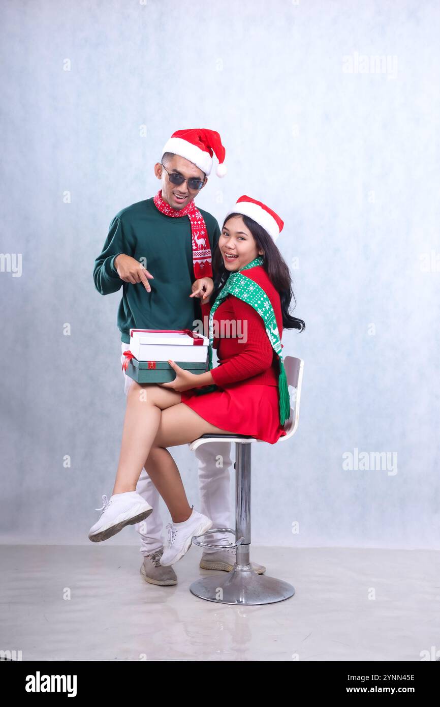 Asian couple wearing santa hi-res stock photography and images - Alamy