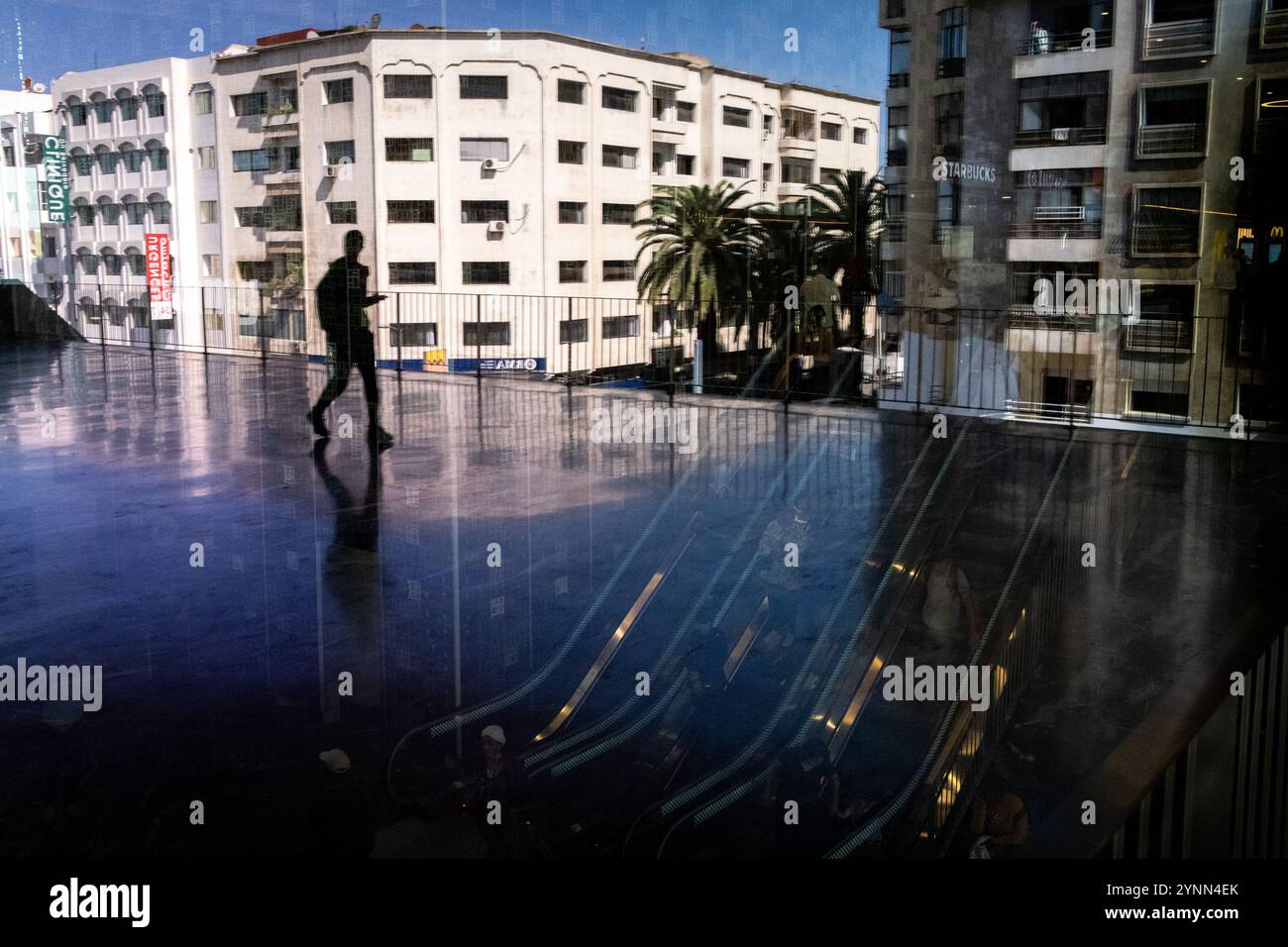 Reflection of a residential building showing the city s population ...