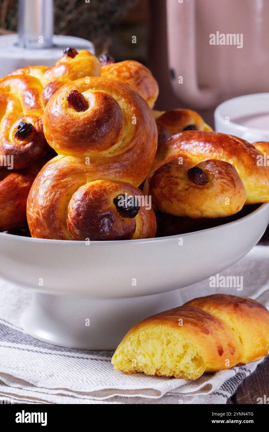 Traditional saffron Swedish buns lussekatt in different shapes, served ...