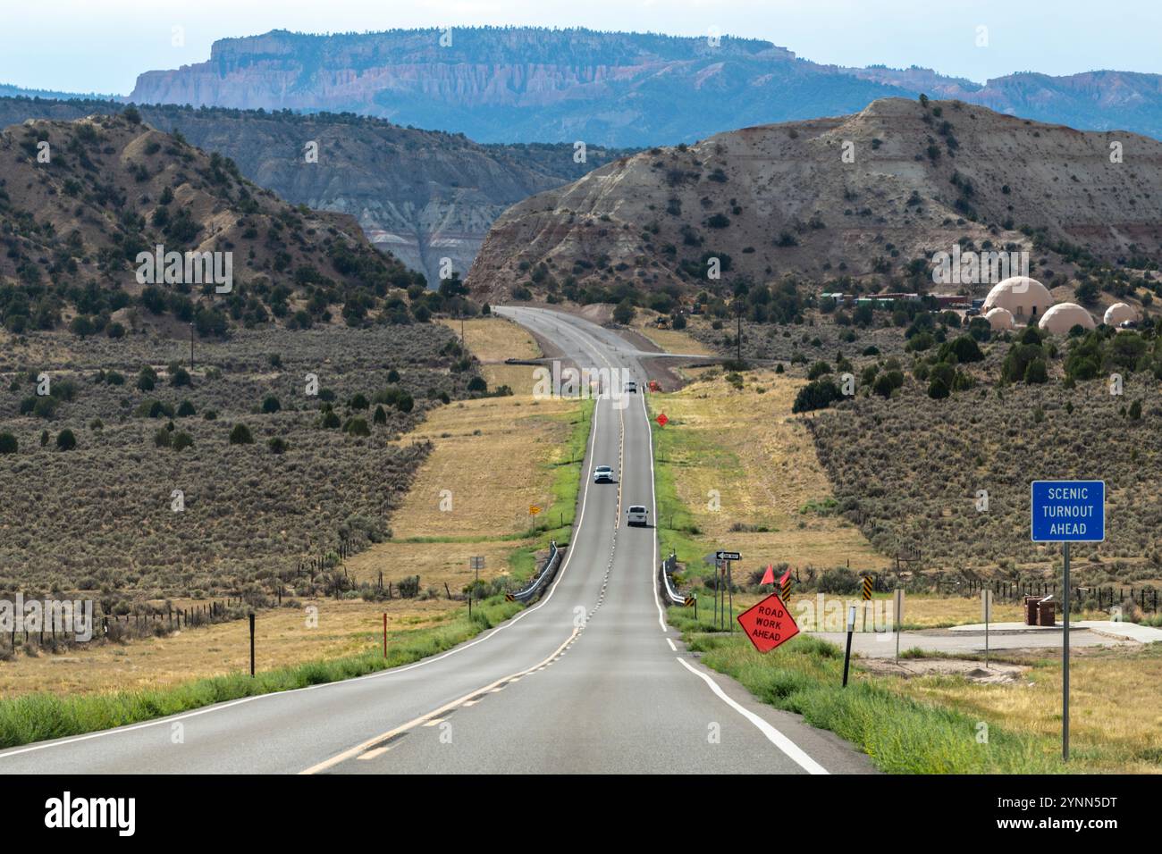 View down a highway through the rugged and arid southwestern Utah ...