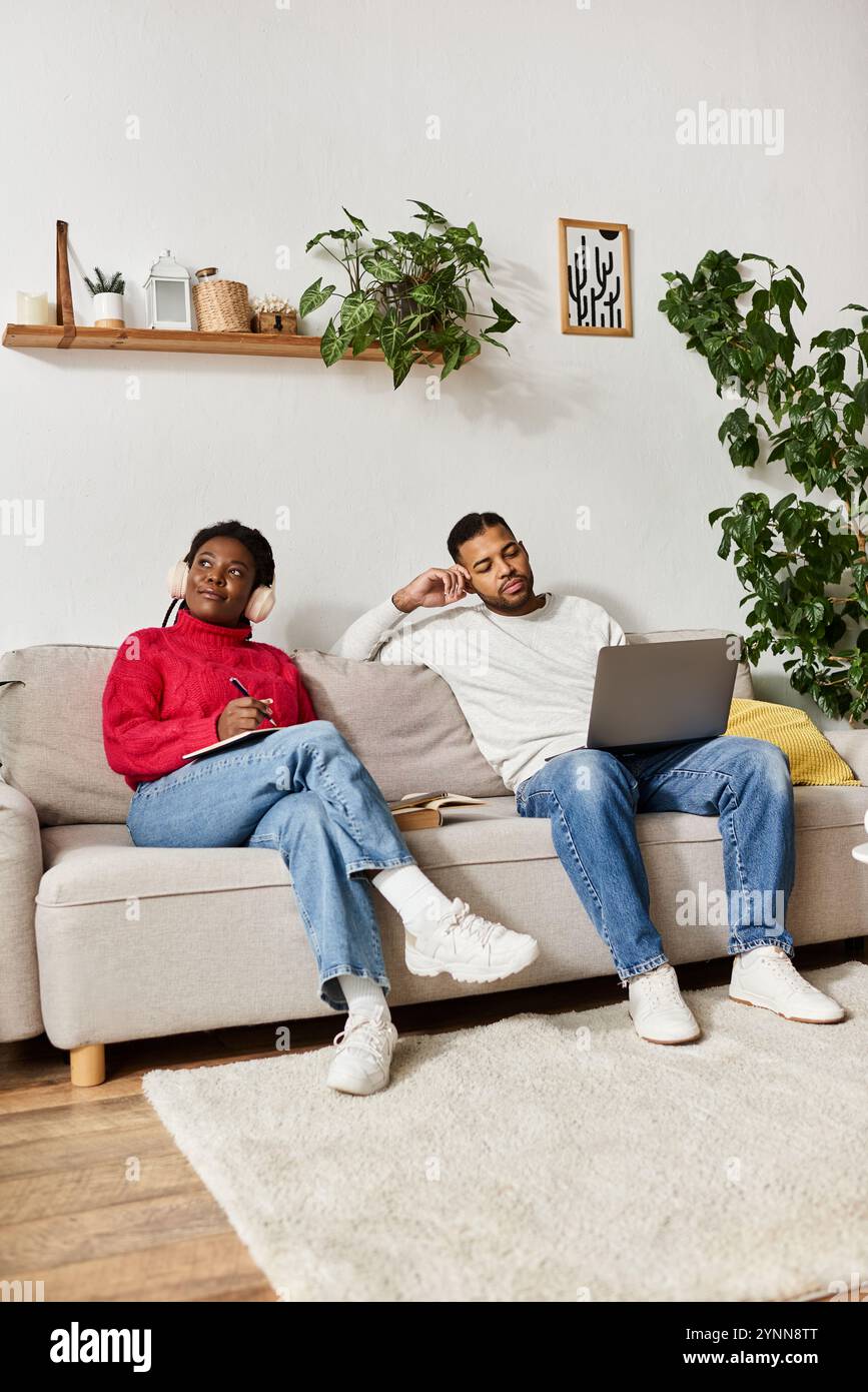 A happy couple enjoys quality time together in their cozy winter living ...