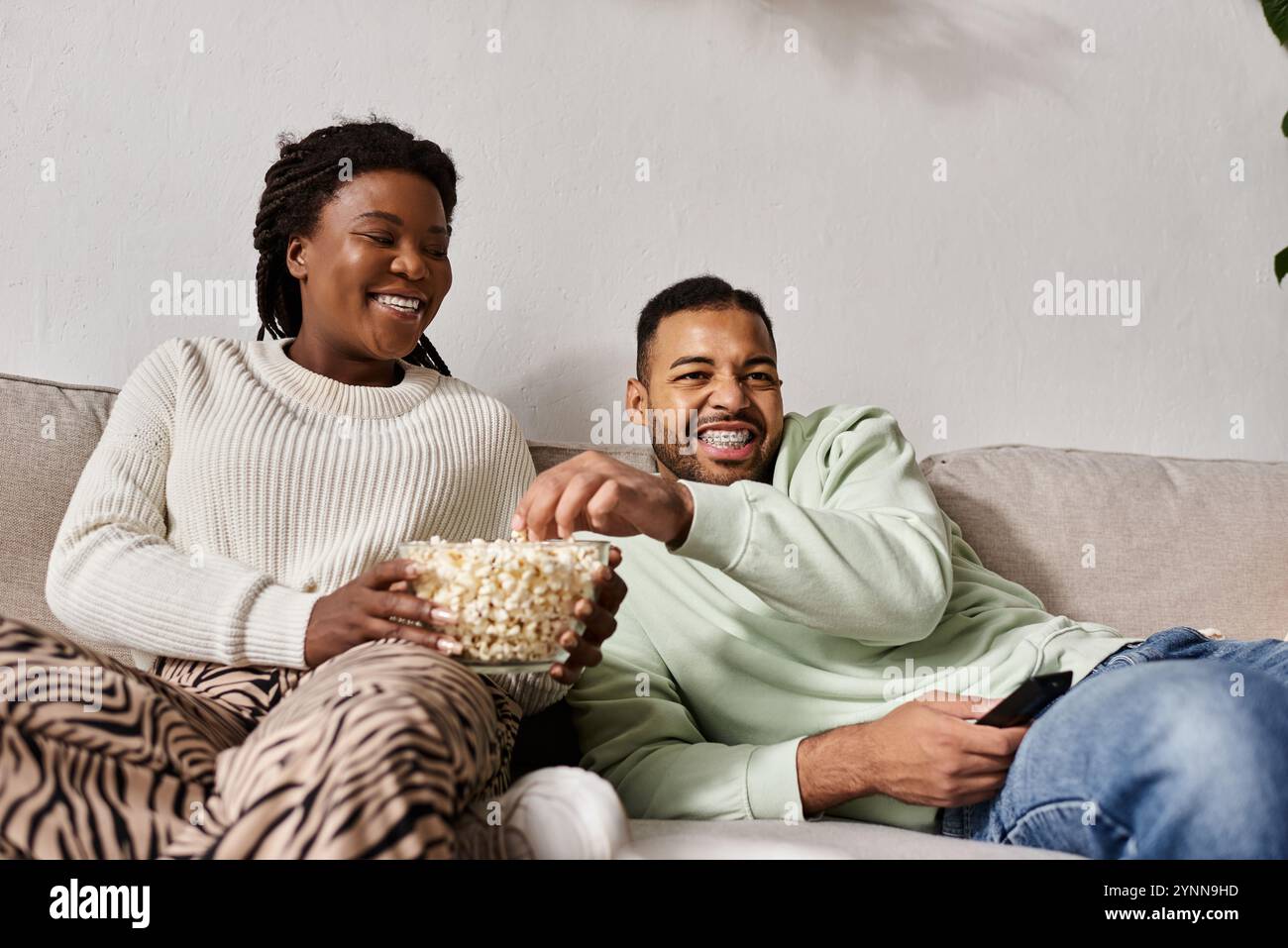 A joyful couple enjoys quality winter time together, sharing laughter ...
