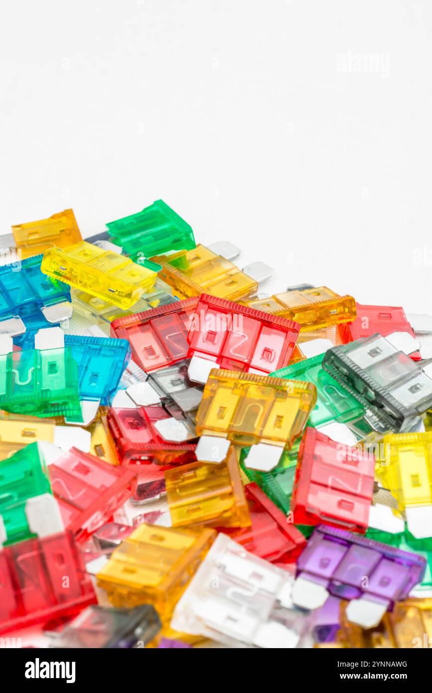 Unsorted mass of colourful automotive plug-in car fuses in their ...