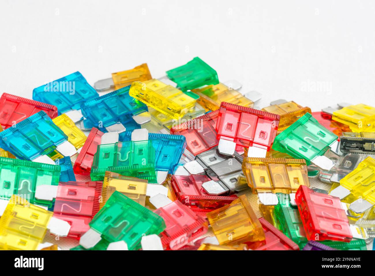 Unsorted mass of colourful automotive plug-in car fuses in their ...