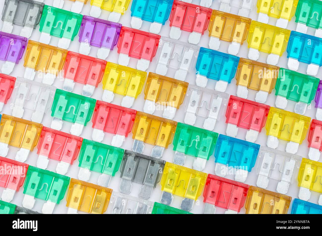 Neatly arranged mass of colourful automotive plug-in car fuses in their ...