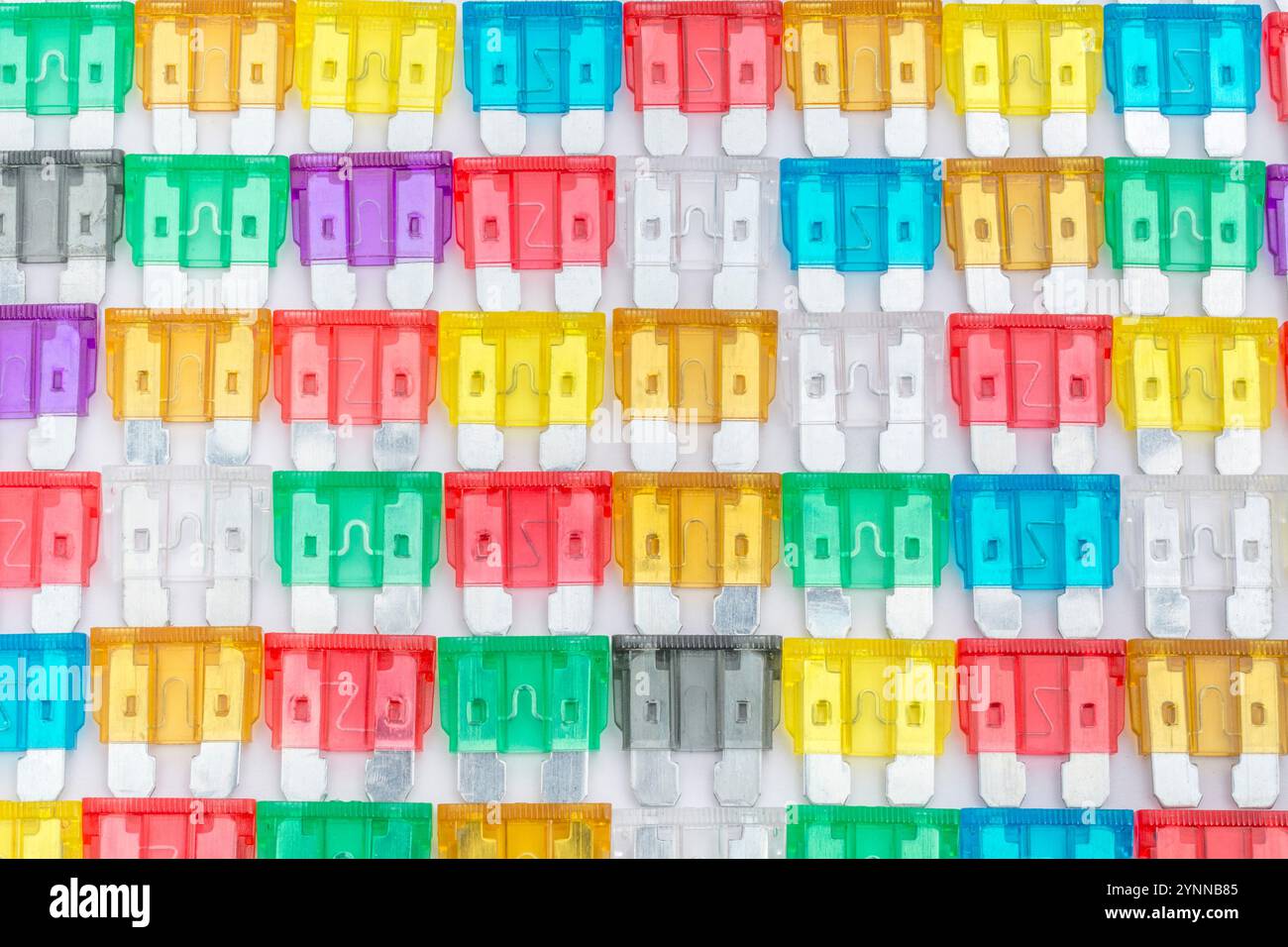 Neatly arranged mass of colourful automotive plug-in car fuses in their ...