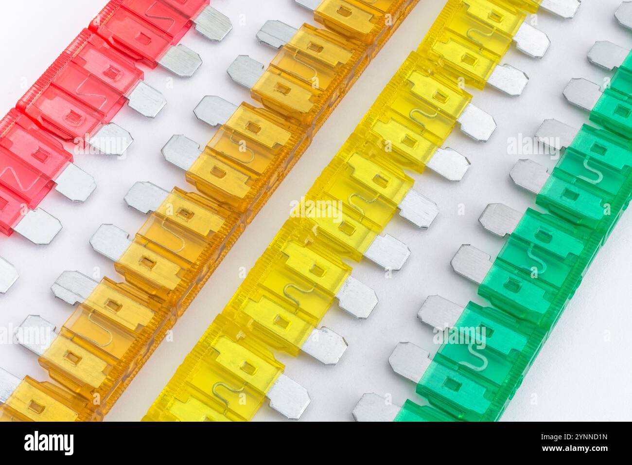 Neatly aligned mass of colourful automotive plug-in car fuses in their ...