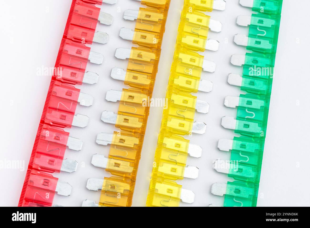 Neatly aligned mass of colourful automotive plug-in car fuses in their ...