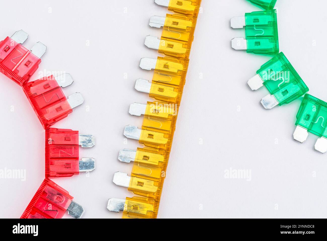 Neatly aligned mass of colourful automotive plug-in car fuses in their ...