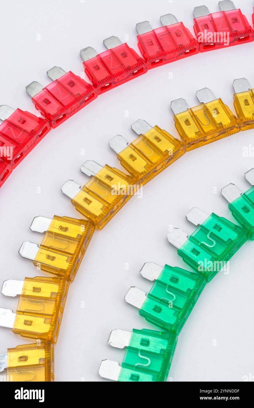 Neatly aligned mass of colourful automotive plug-in car fuses in their ...