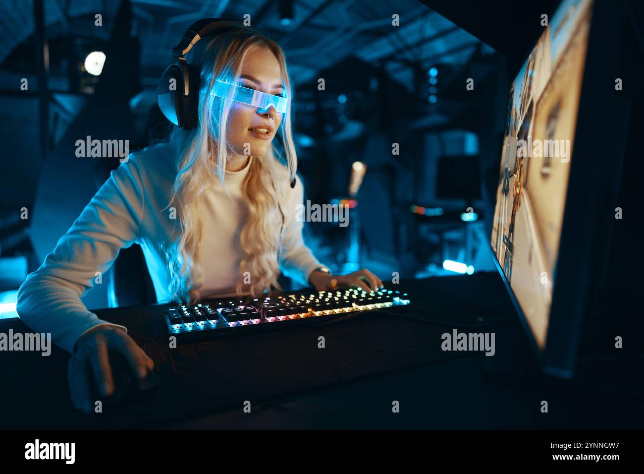Young woman engaged in competitive gaming in a modern setup Stock Photo ...