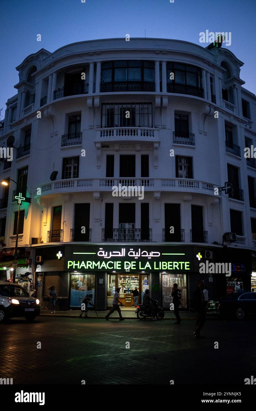 Pharmacy at the bottom of a residential building of neo-Moorish ...