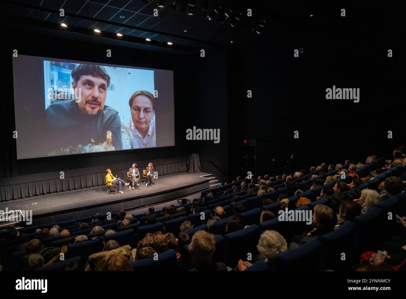 On Screen, Via Zoom (L to R) Slava Leontyev and Anya Stasenko. On Stage ...