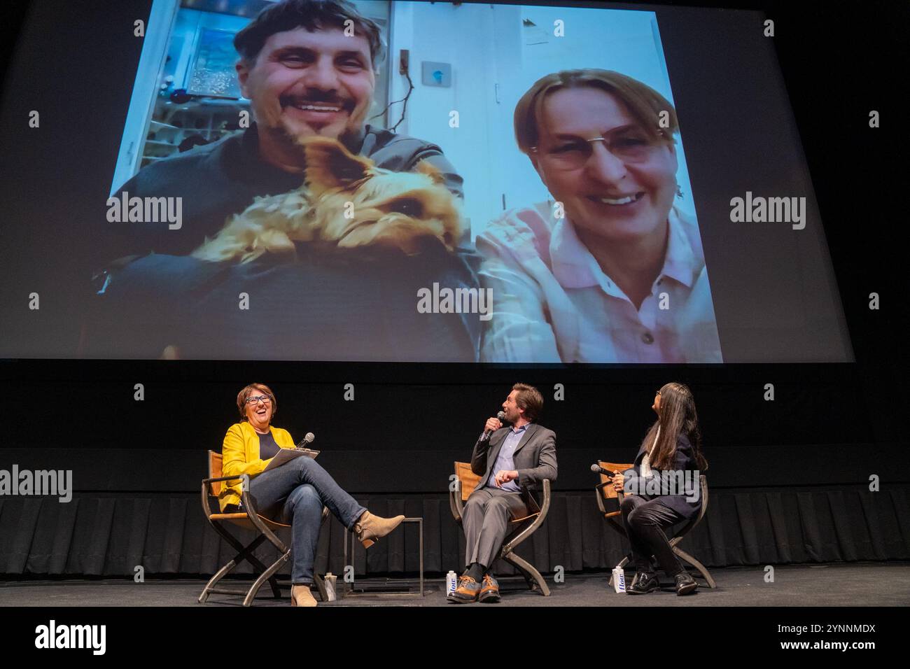 On Screen, Via Zoom (L to R) Slava Leontyev and Anya Stasenko. On Stage ...